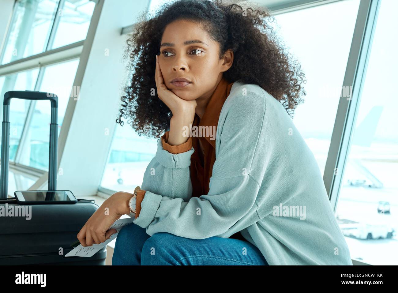 Airport, flight delay and depressed woman sad for immigration fail ...