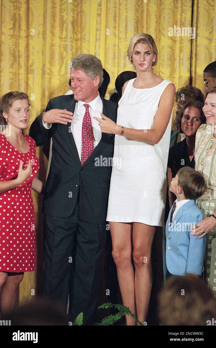 President Bill Clinton poses with six-foot, seven-inch Gwendolyn ...