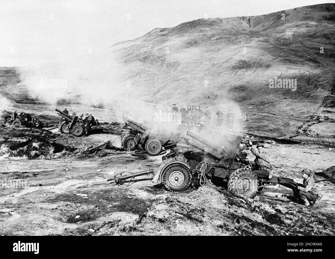 Guns blaze away in practice as Major General Russell P. Hartle and ...
