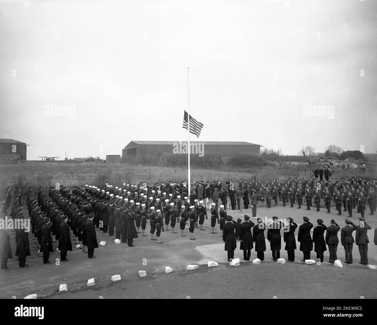 The Royal Air Force flag being lowered and the American flag being ...
