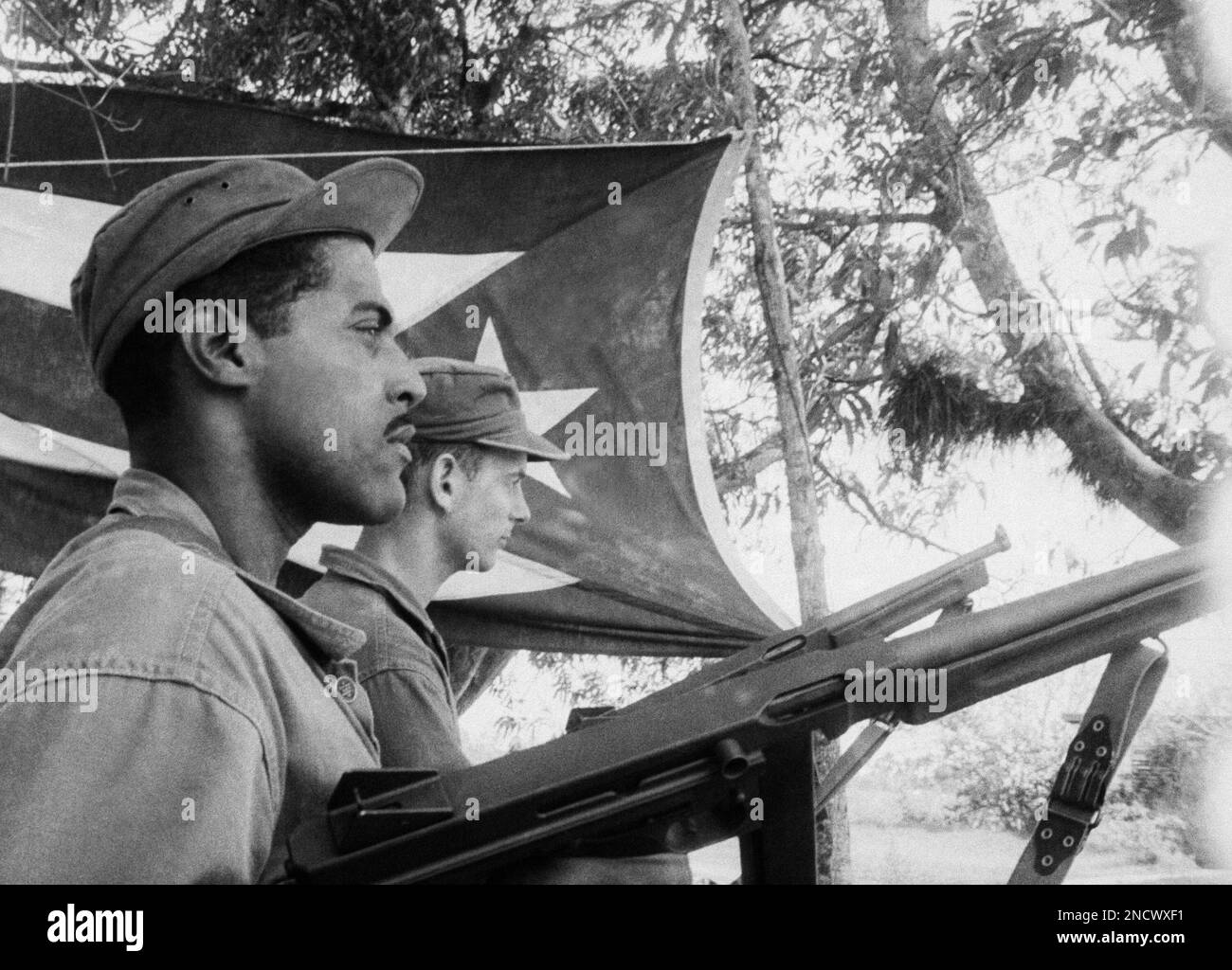 With a Cuban flag in the background, two Cuban refugees train for the ...