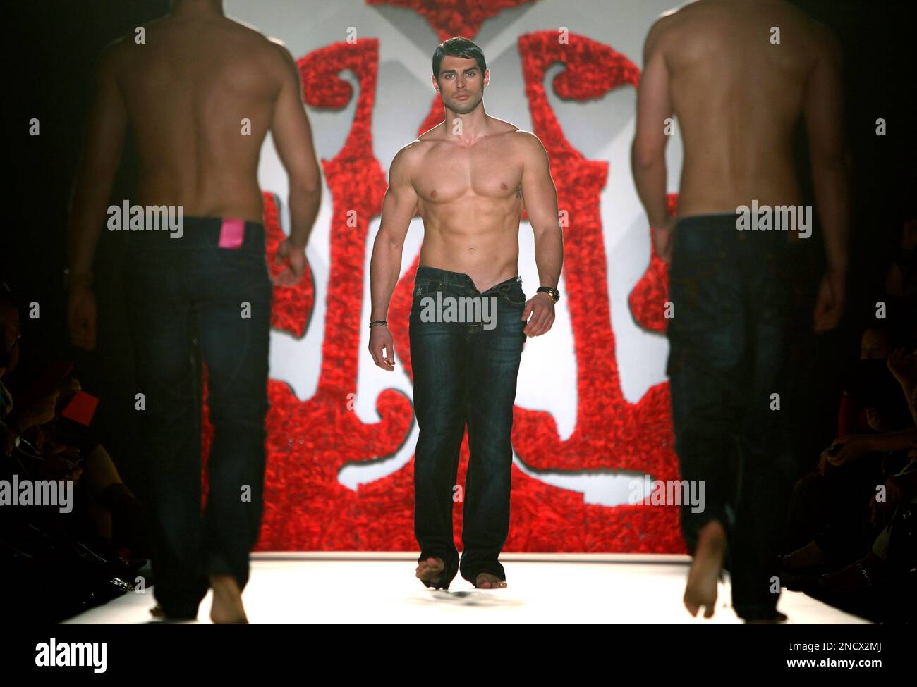 Models present outfits by Greek designers Nikos - Takis during a Greek ...