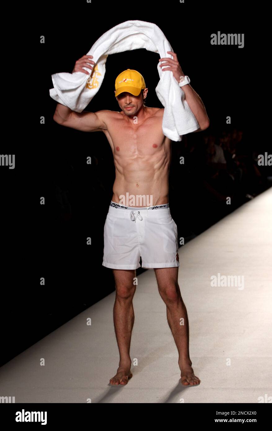 A model presents an outfit by Greek designers Nikos - Takis during a ...