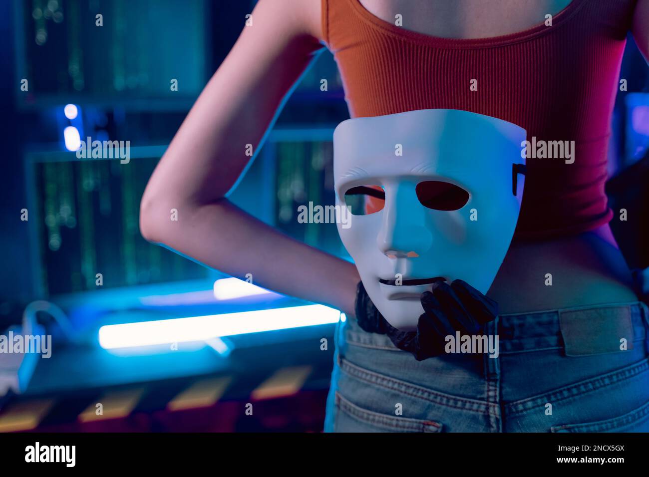 Young woman hiding a mysterious mask in hideout place with dark ...