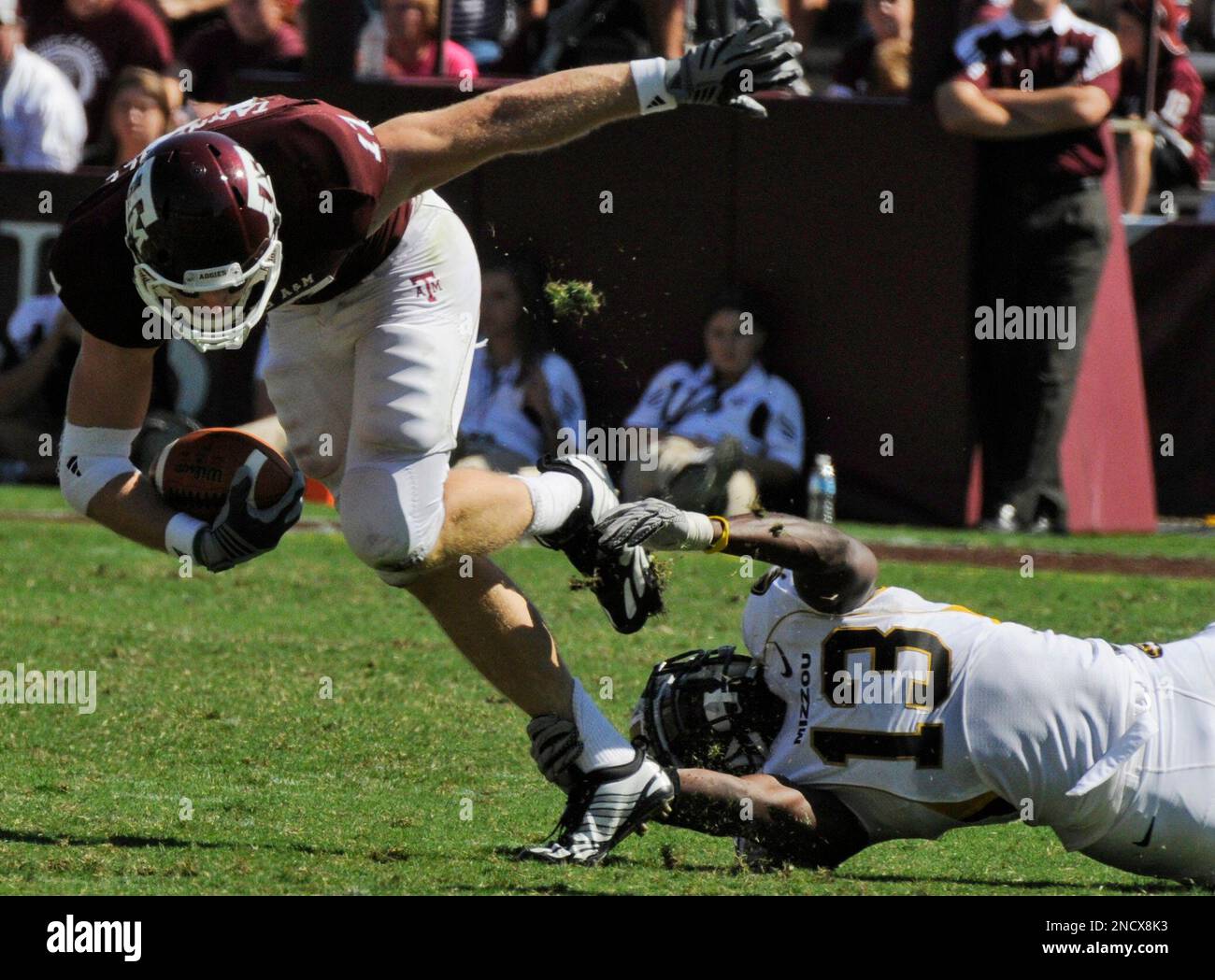 Texas A&M receiver Terrence McCoy (11) tries to gain ground as Missouri ...