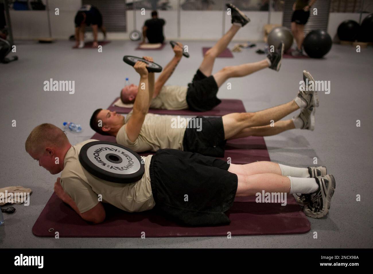 Soldiers exercise in a gym at Kandahar Airfield, Afghanistan, Saturday ...