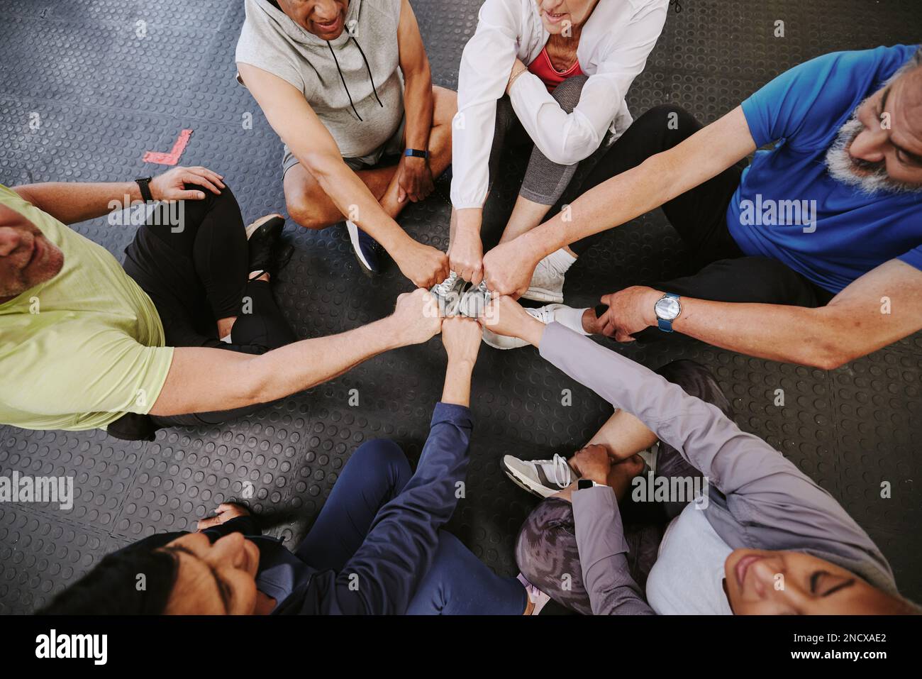 Fist bump, fitness and people n gym training group, circle and ...