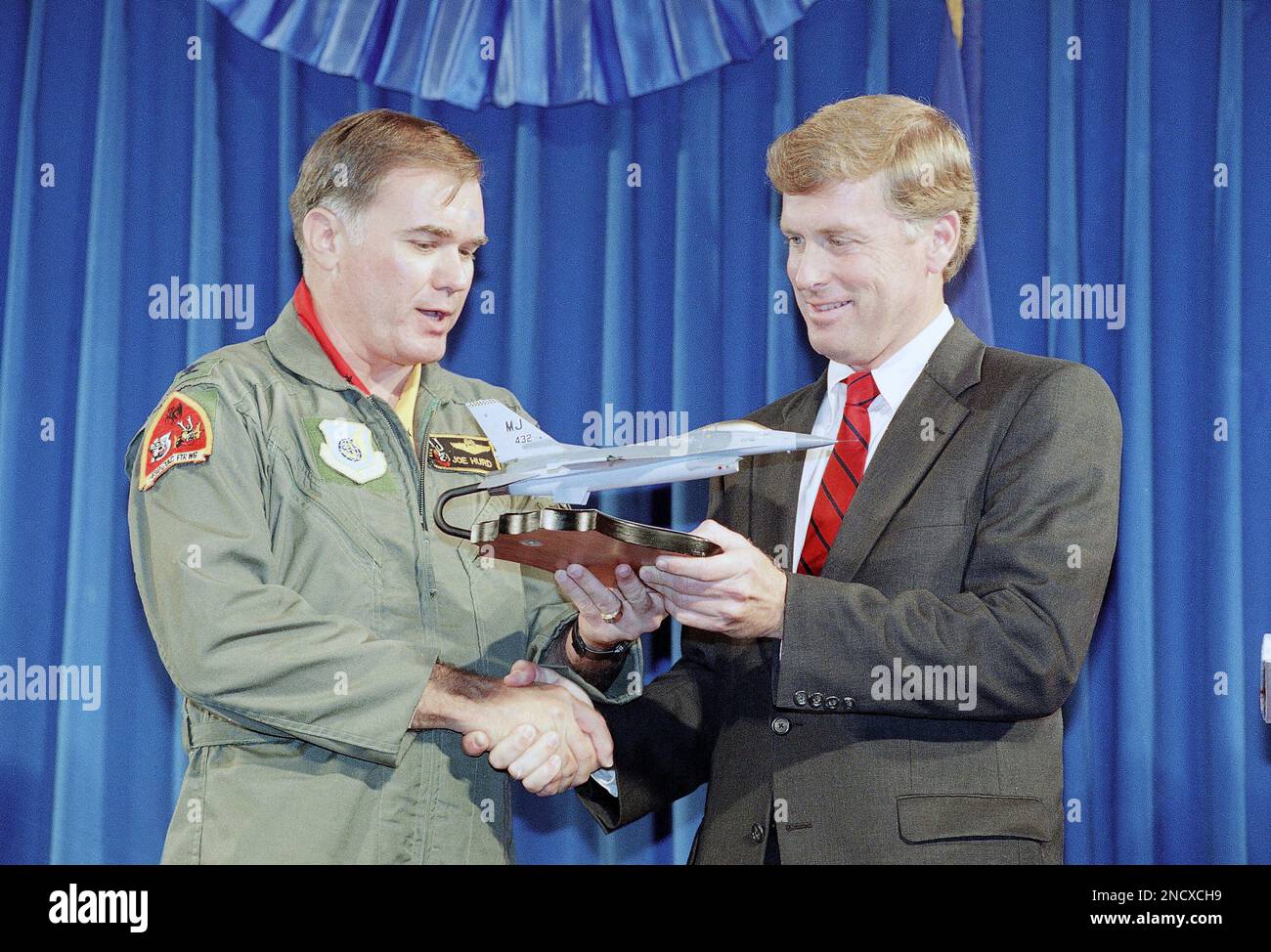 Vice President Dan Quayle, right, receives a model of U.S. fighter from ...