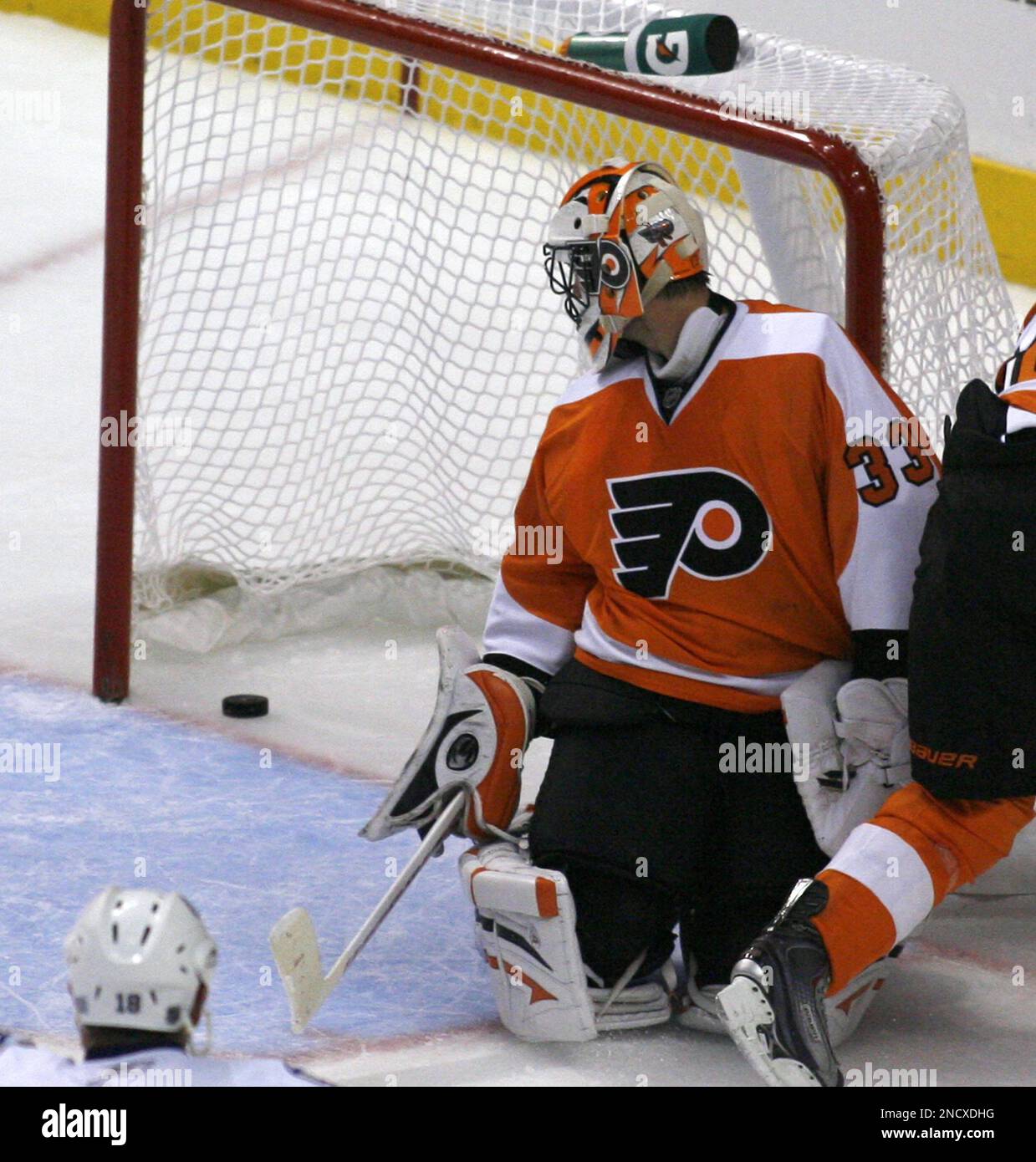 Philadelphia Flyers' Brian Boucher (33) looks at the puck after Tampa ...