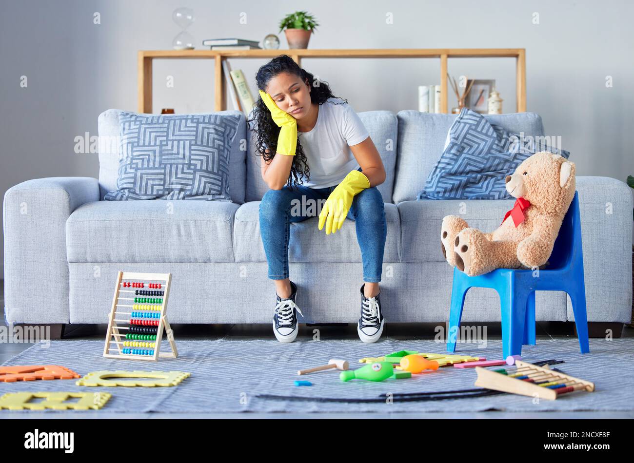 Tired, cleaning and black woman in living room with chaos and stress ...