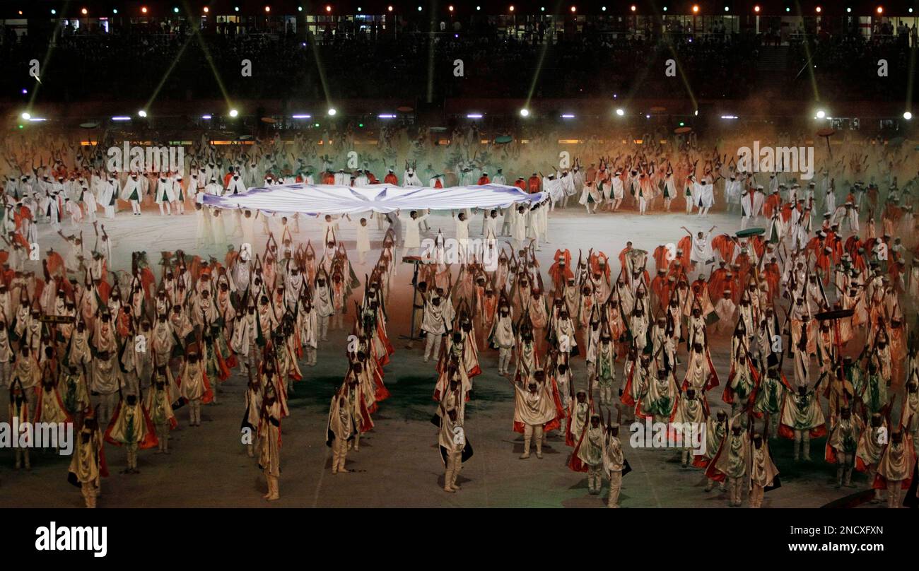 School children, draped in the colors of the Indian national flag ...