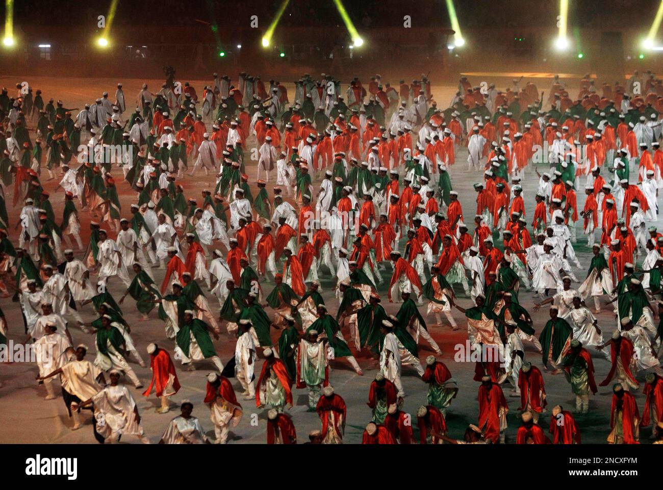 School children, draped in the colors of the Indian national flag ...