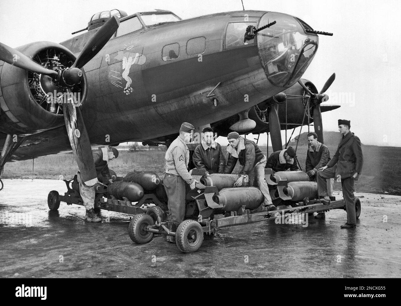 Members of an 8th Air Force Ordnance Unit load up the Flying Fortress ...
