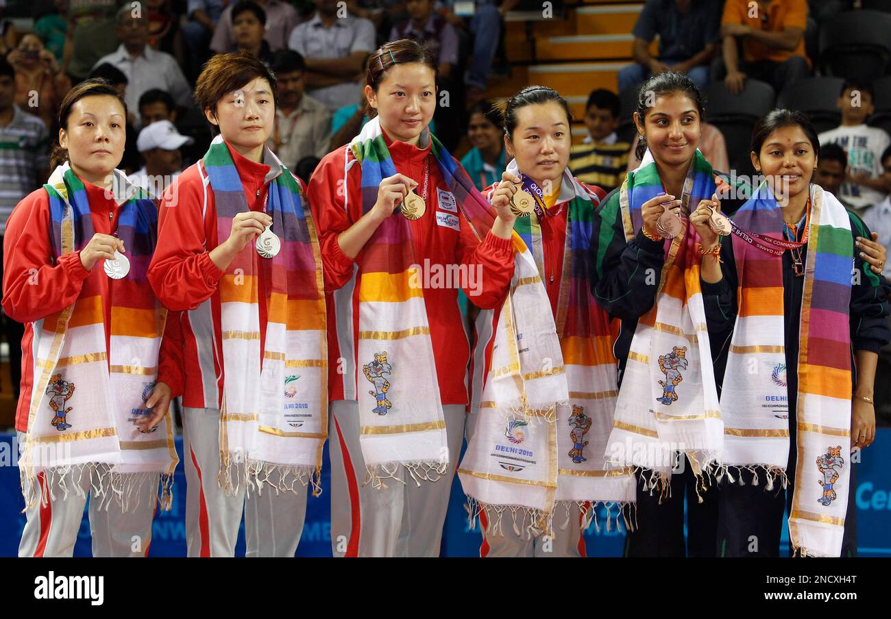From left, Singapore's Wang Yuegu, Feng Tianwei, silver, Li Jiawei, Sun ...