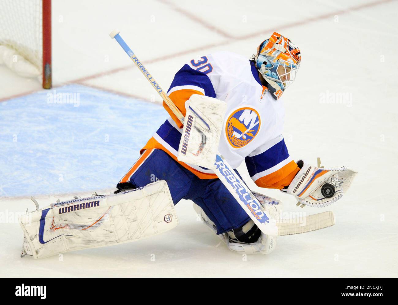 New York Islanders goalie Dwayne Roloson stops the puck during the ...