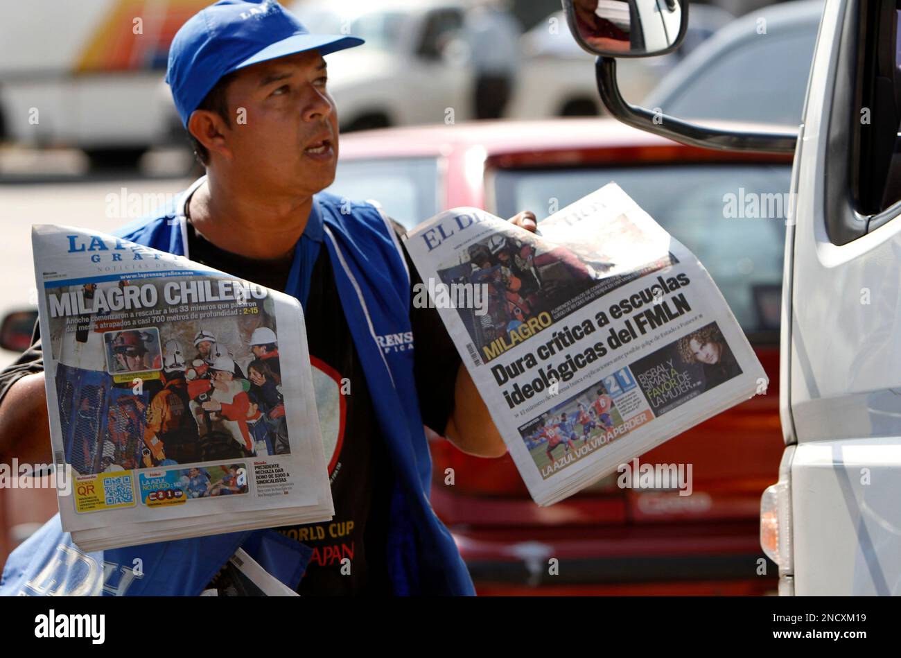 Street vendor Mario Enrique Mejia sells Salvadorian newspapers whose ...