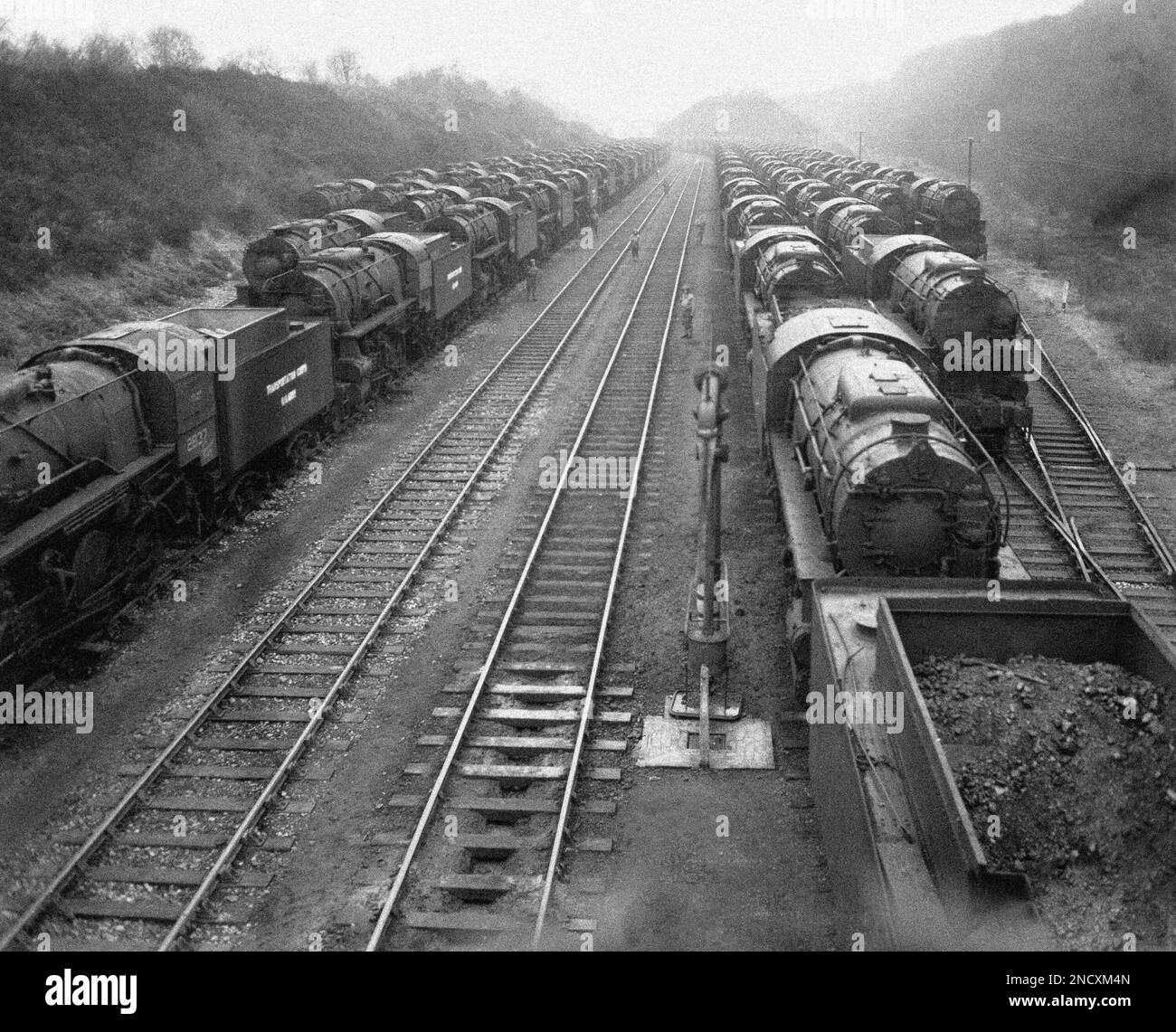 Stored on spur tracks alongside two open main lines somewhere in ...