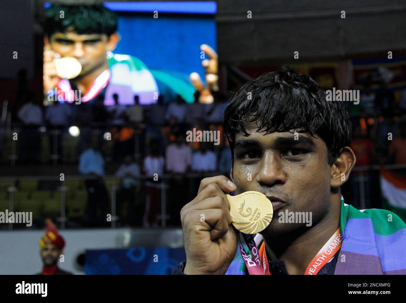 Indian boxer Paramjeet Samota kisses his gold medal for the Super Heavy ...