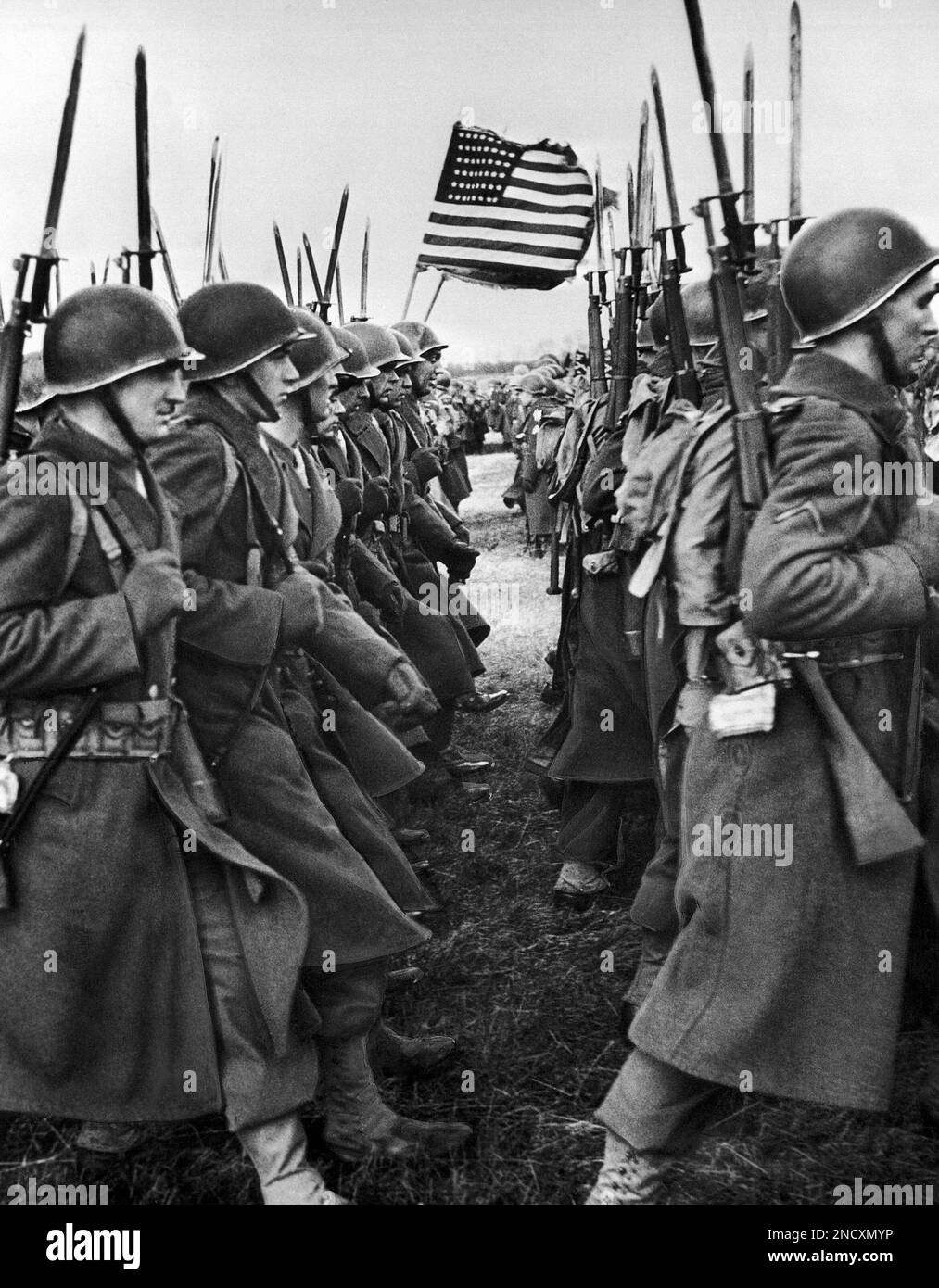 U.S. Glider troops parade at an airfield somewhere in England as ...