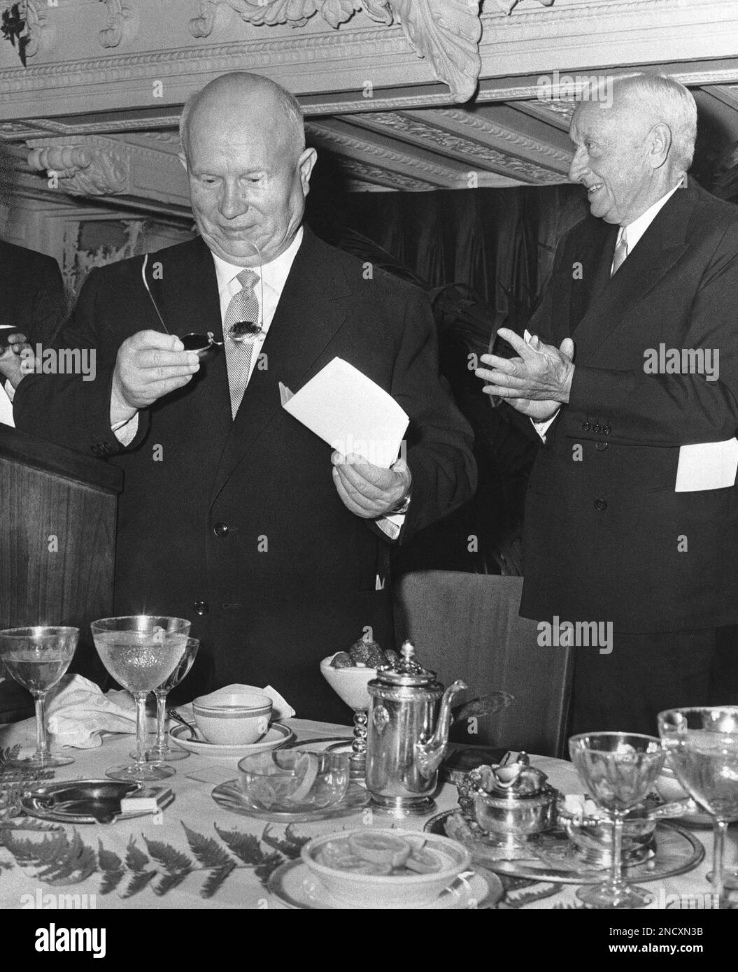 Soviet Premier Nikita S. Khrushchev glances down at glittering ...