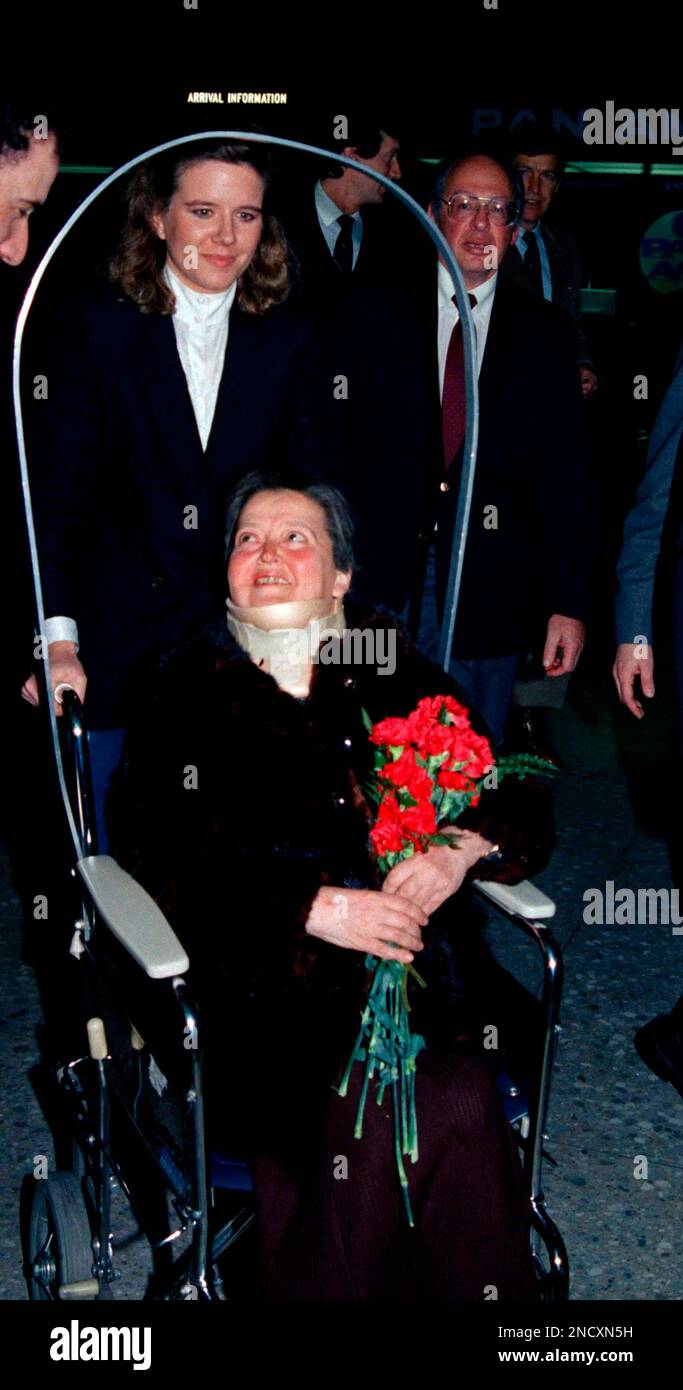 Inna Meiman, wife of Soviet dissident Naum Meiman, is escorted by ...