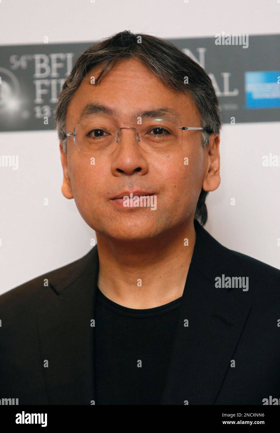 Japanese novelist Kazuo Ishiguro poses for photographs during a photo ... Japanese novelist Kazuo Ishiguro poses for photographs during a photo ...