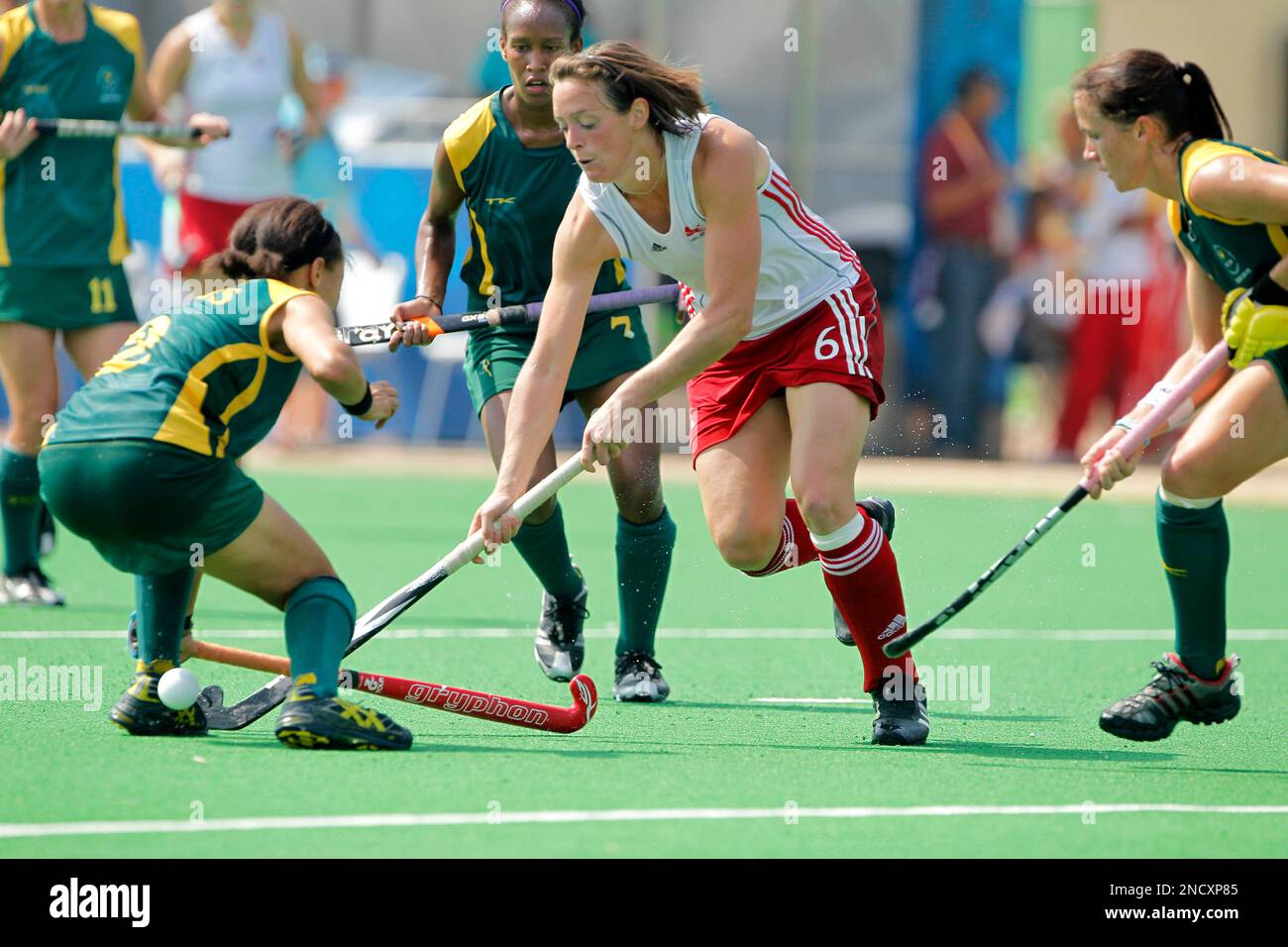 England's Hannah Macleod, center, approaches South Africa's goal area ...