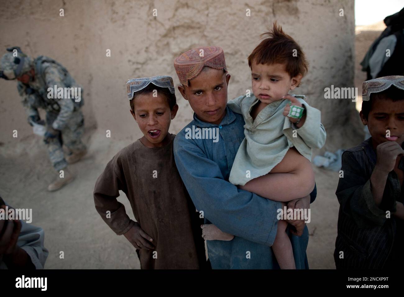 In this photo taken on Monday, Oct.10, 2010, Afghan children stand ...