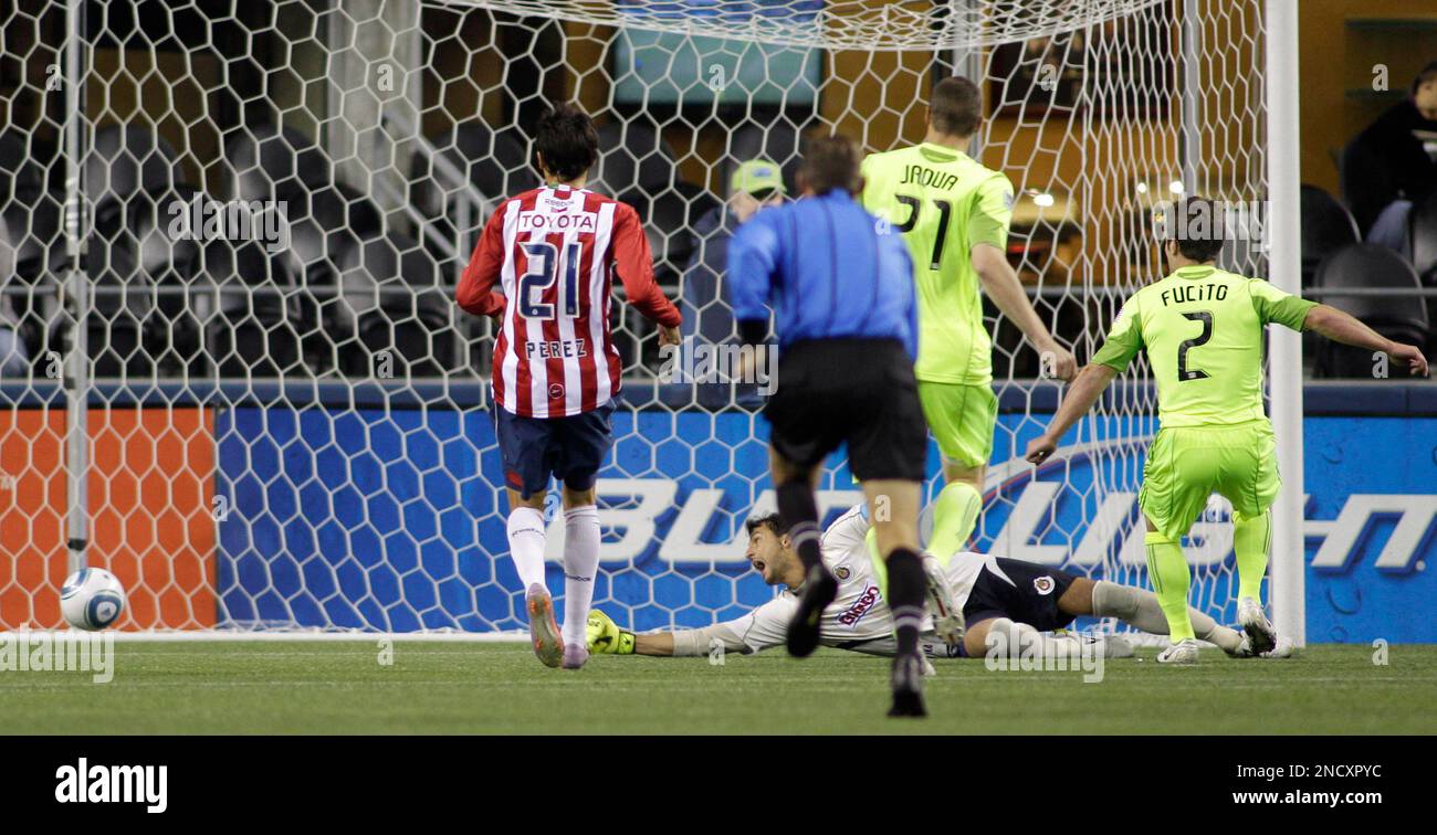 Seattle Sounders' Michael Fucito, right, watches as his goal shot gets ...