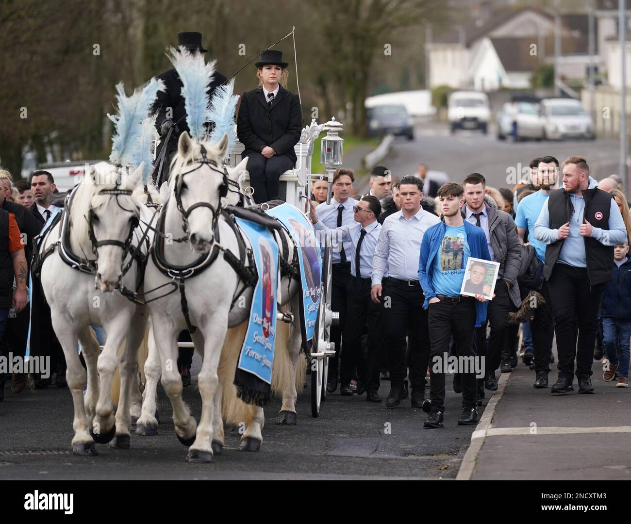 The horse-drawn carriage carrying the coffin of John Keenan arrives for ...