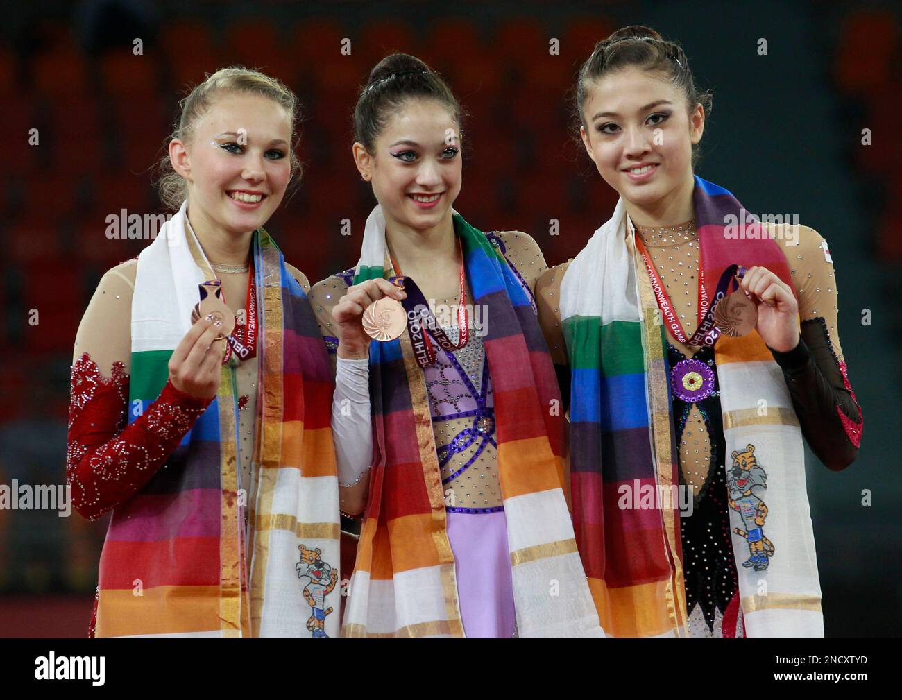 England's gymnasts, from left to right, Francesca Fox, Rachel Ennis and ...