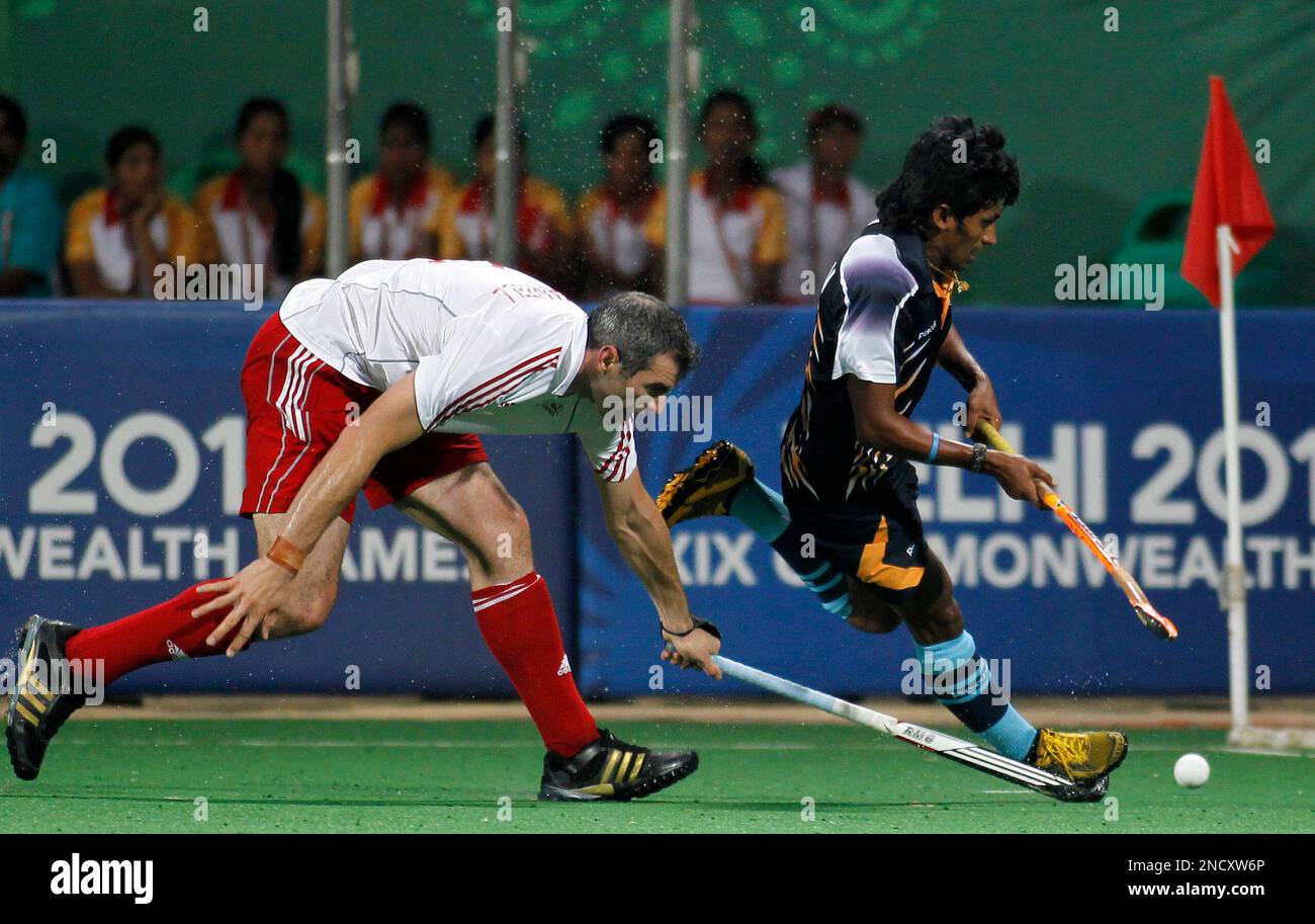 England's Nick Caitlin, left, and India's Arjun halappa fight for the ...