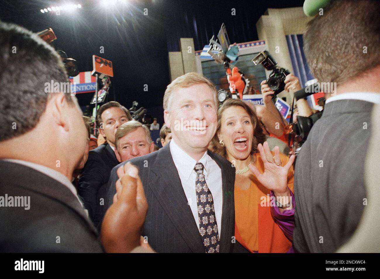 Vice President Dan Quayle smiles and his wife Marilyn waves to a well ...