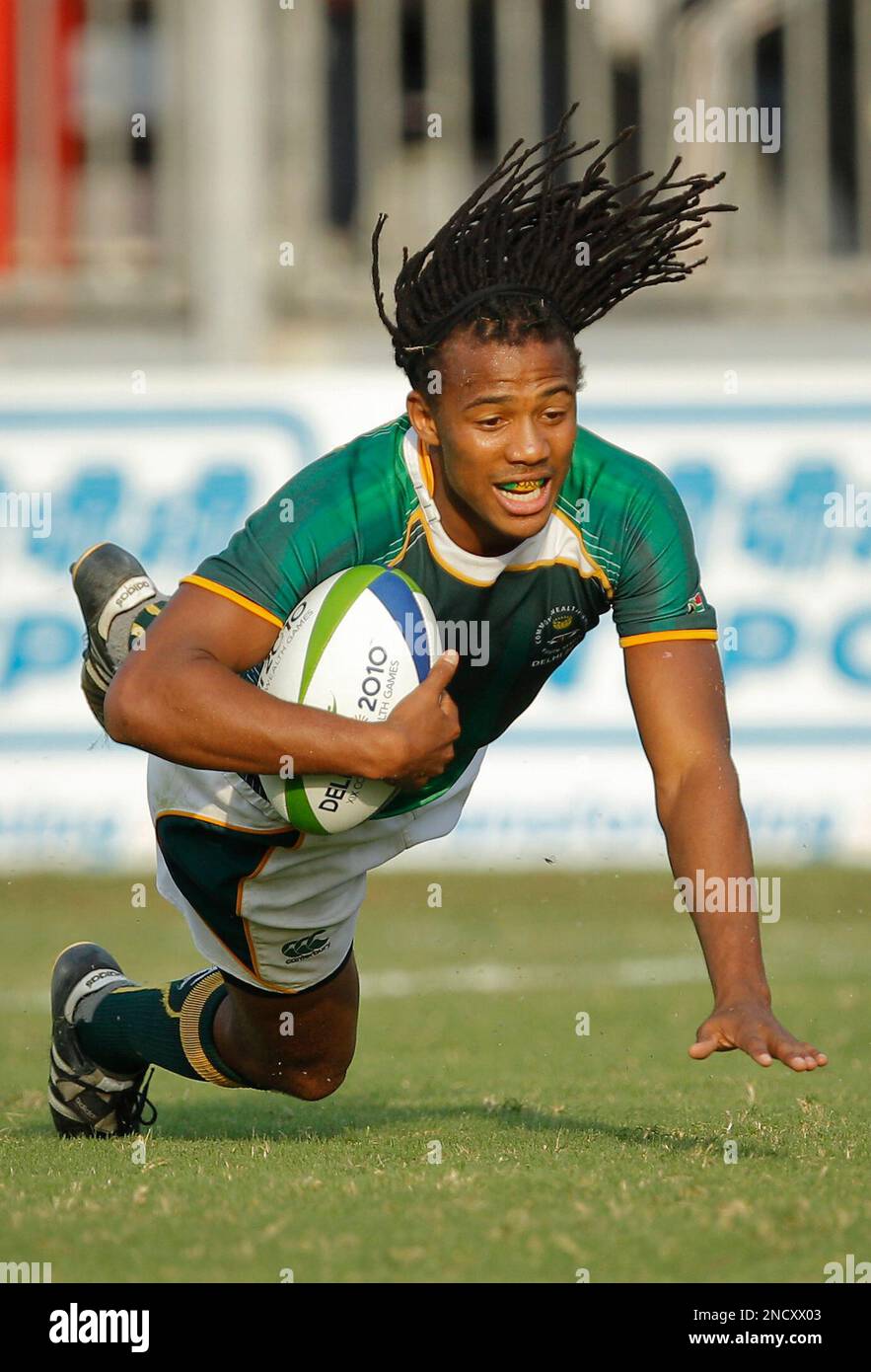 South Africa's Cecil Afrika scores a try against England in their rugby ...
