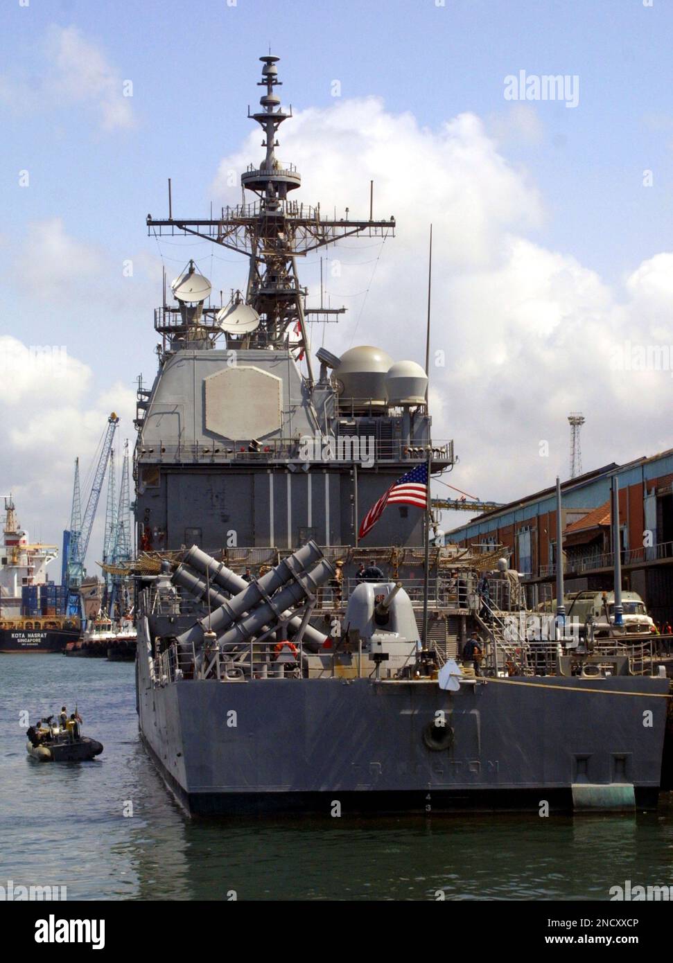 Kenyan police officers patrol by the US Naval warship USS Princeton at ...