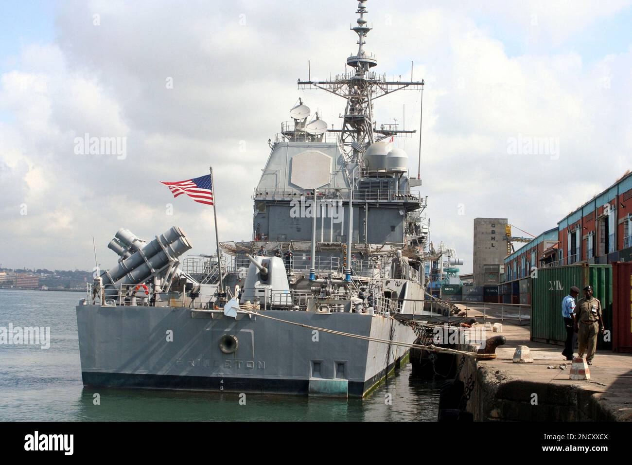 Kenyan police officers patrol by the US Naval warship USS Princeton at ...