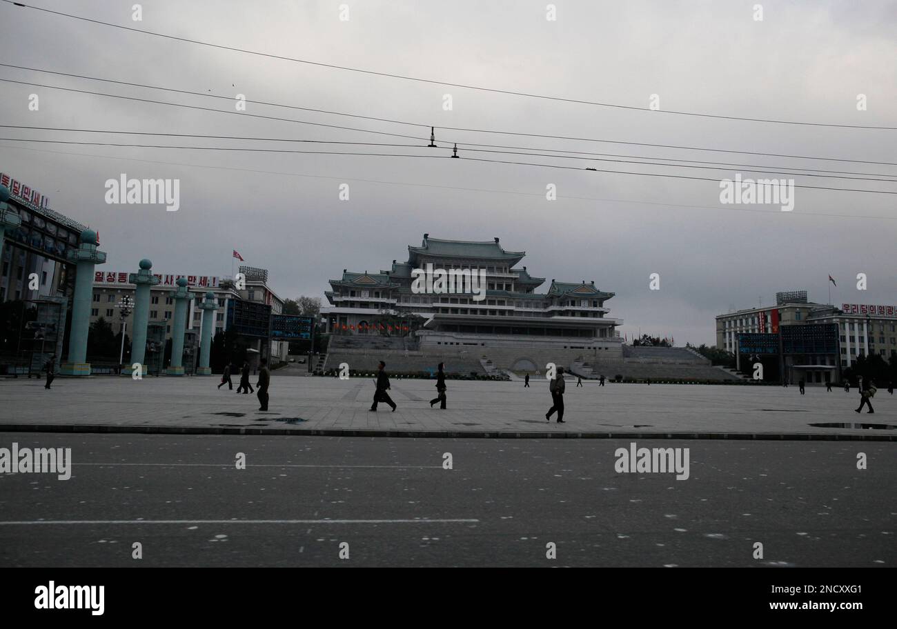 North Korean people walk by Kim Il Sung Square in Pyongyang, North ...