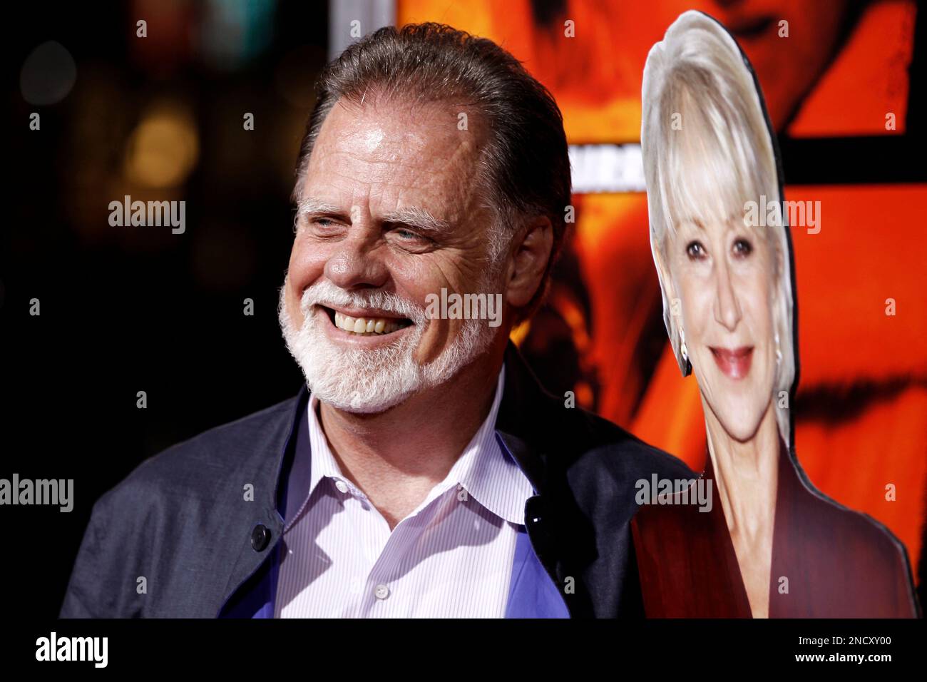 Taylor Hackford, left, arrives with a cardboard cutout of his wife ...