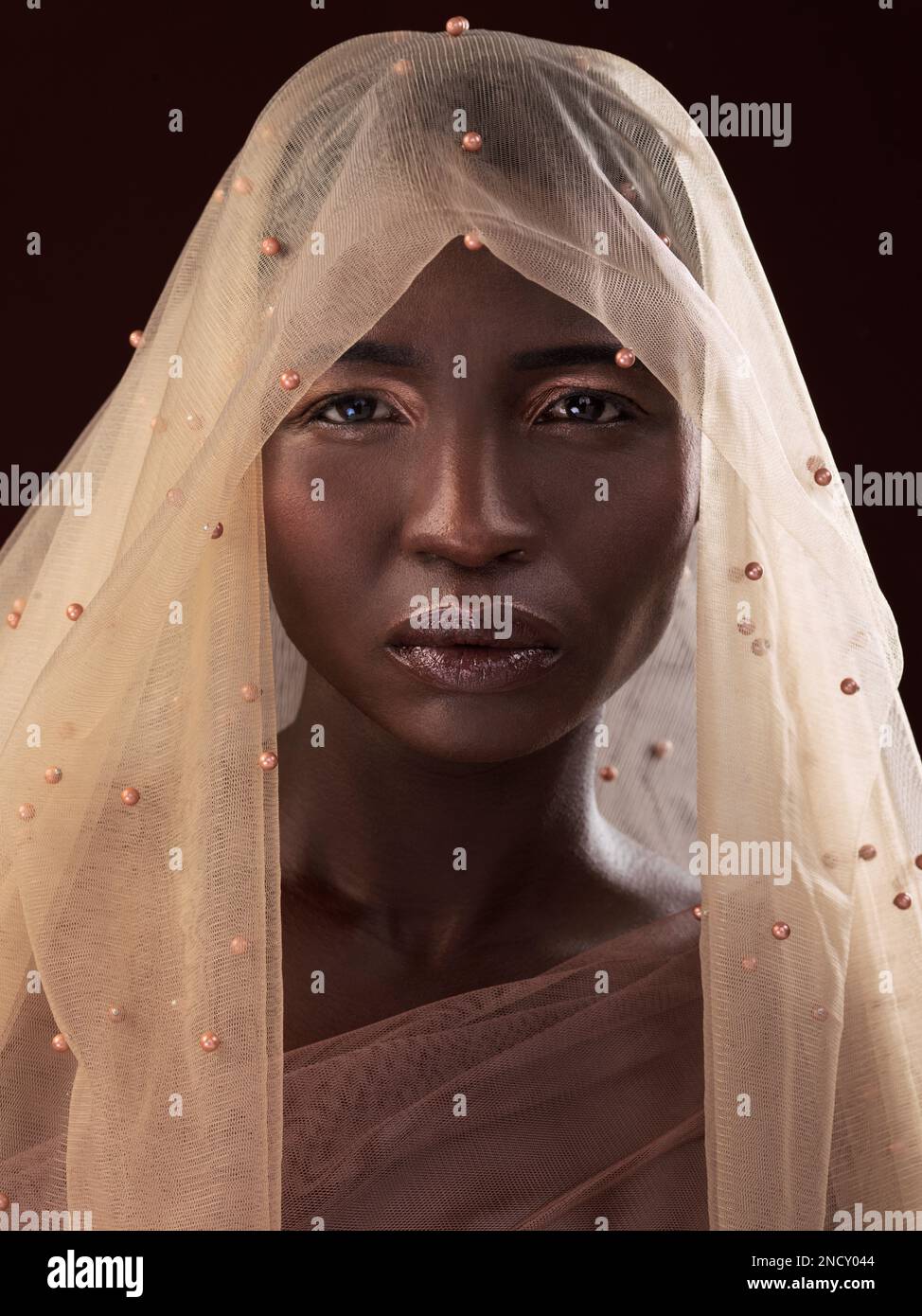 Defining beauty. Studio portrait of an attractive young woman posing in ...