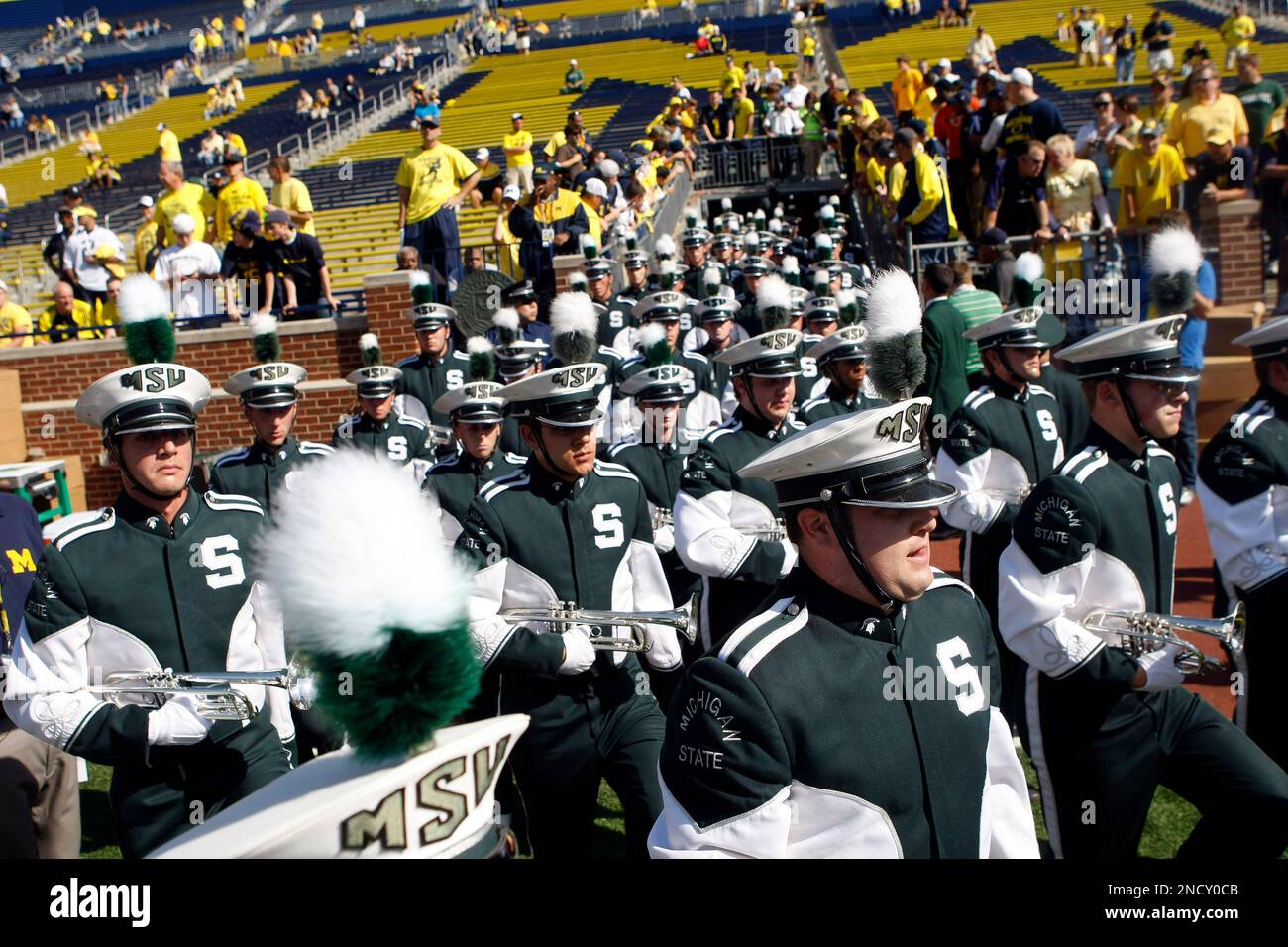 The Michigan State marching band enter Michigan Stadium before an NCAA ...