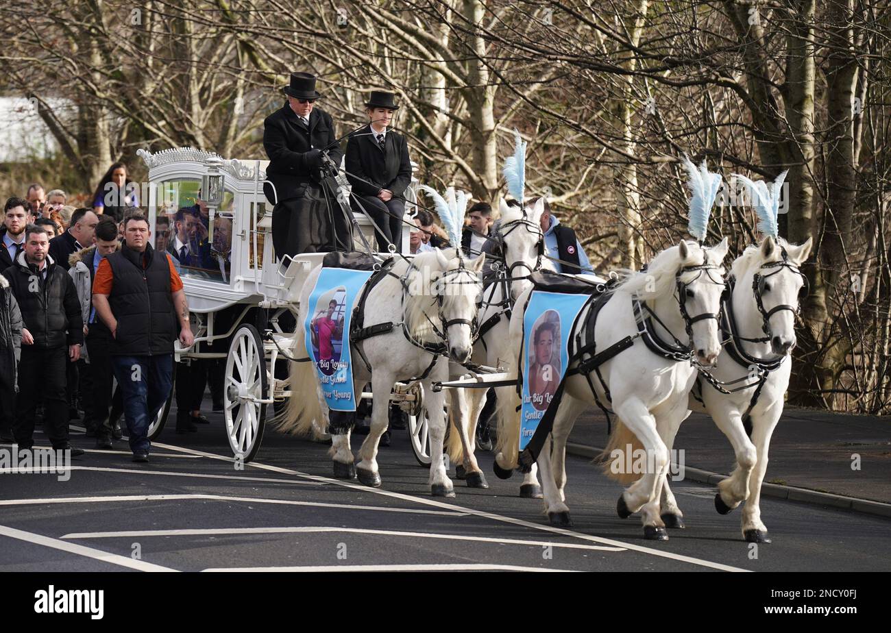 The horse-drawn carriage carrying the coffin of John Keenan arrives for ...