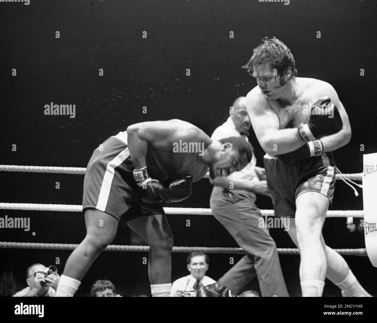 Heavyweight champion Joe Frazier ducks to miss right by challenger Ron ...