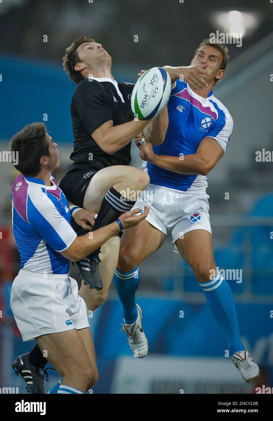 New Zeland's Ben Smith, center, and Scotland's Colin Shaw, right, fight ...