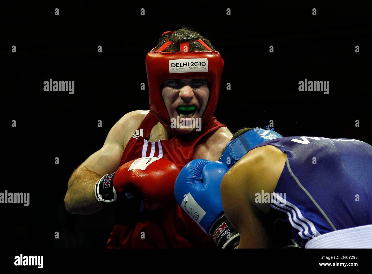Eamonn O'Kane of Northern Ireland, in red, punches Keiran Harding of ...
