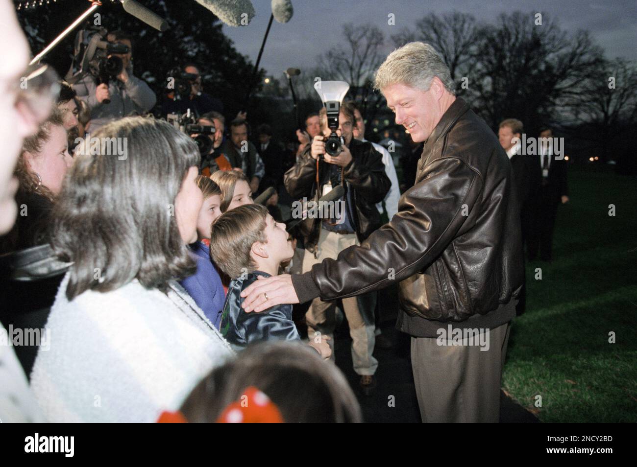 U.S. President Bill Clinton talks to well-wishers on the South Lawn at ...