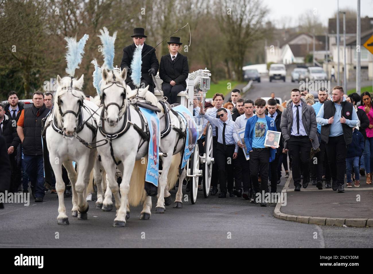 The horse-drawn carriage carrying the coffin of John Keenan arrives for ...