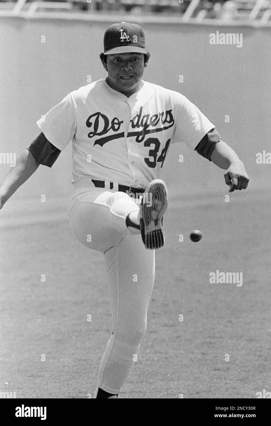 Los Angeles Dodgers' pitcher Fernando Valenzuela relaxes before a game ...