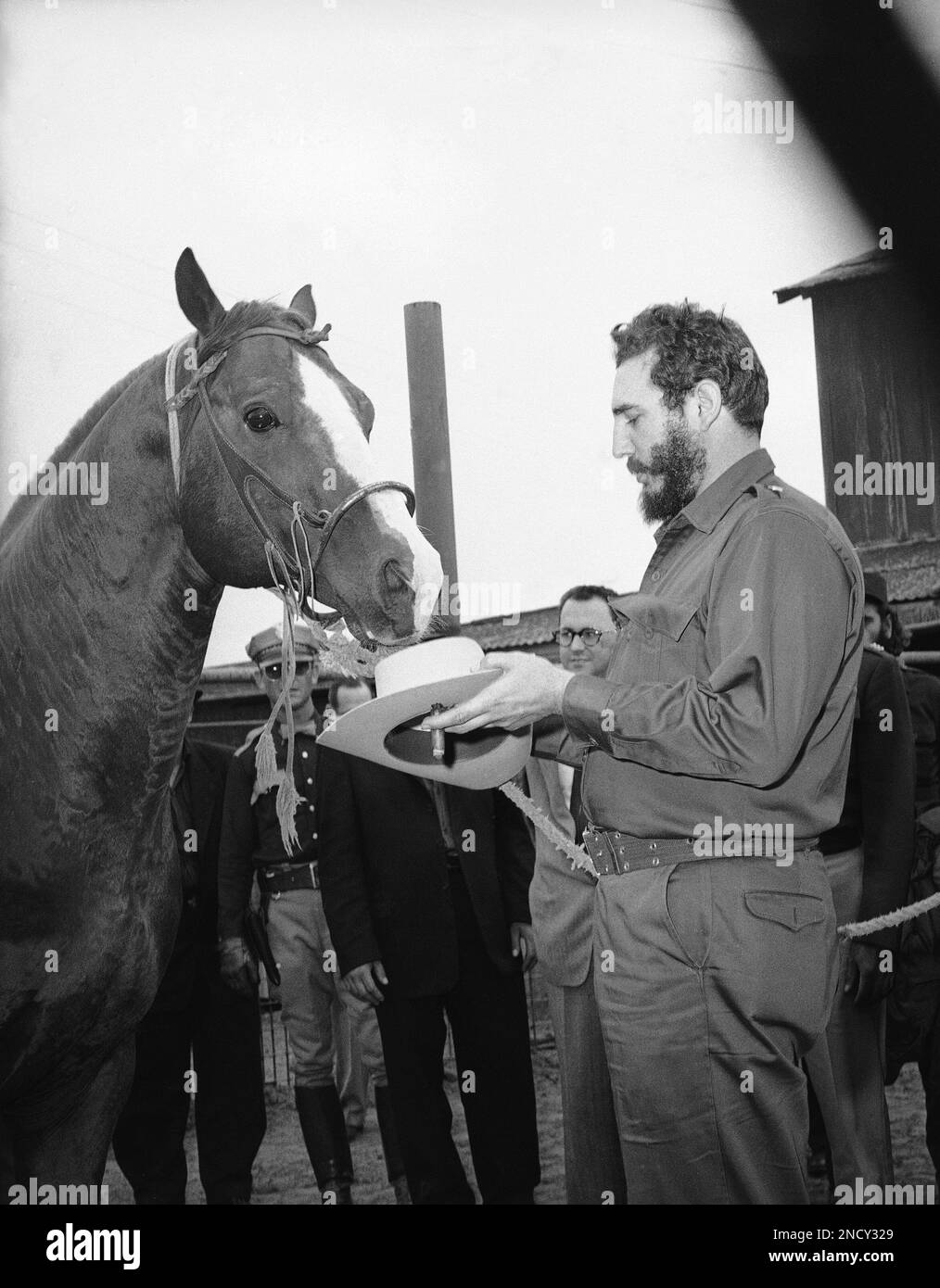 Fidel Castro, Cuba’s Premier, holding his western hat in hand, looks ...