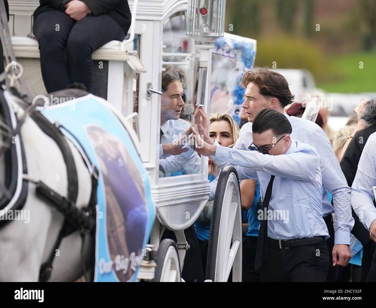 The horse-drawn carriage carrying the coffin of John Keenan arrives for ...