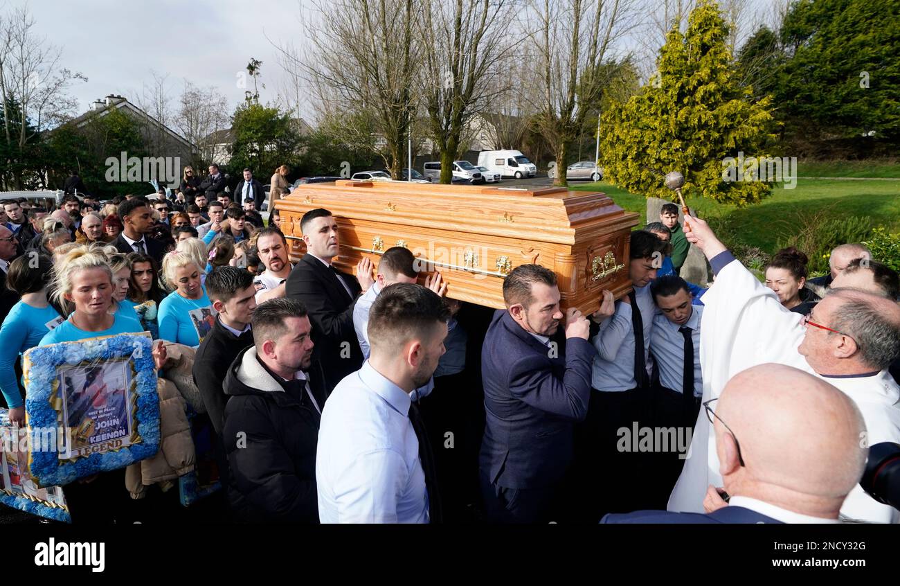 The coffin of John Keenan is carried into the Church of the ...